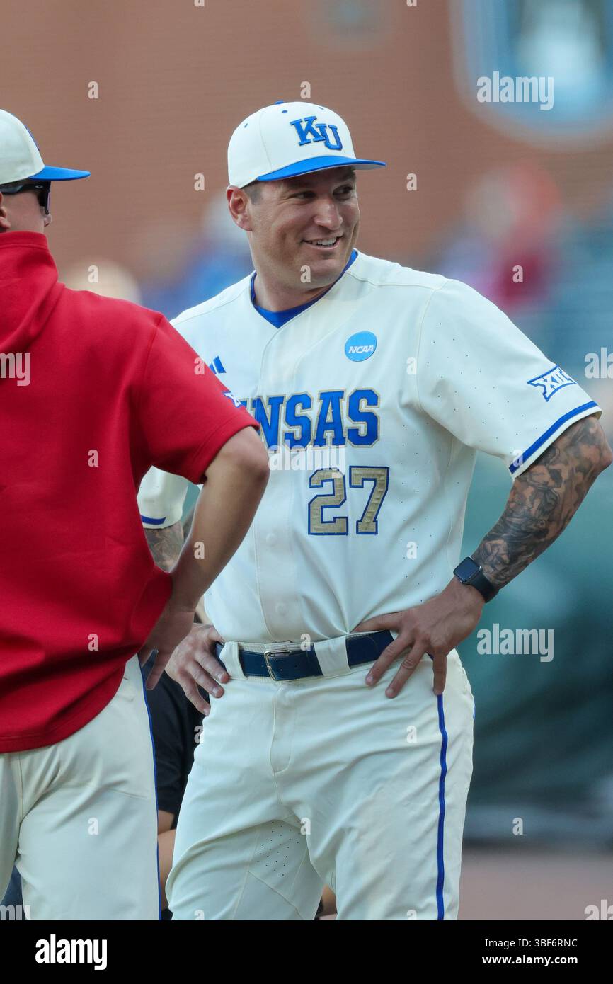 May 30, 2025: Kansas Assistant Coach Jon Coyne glances back into the ...