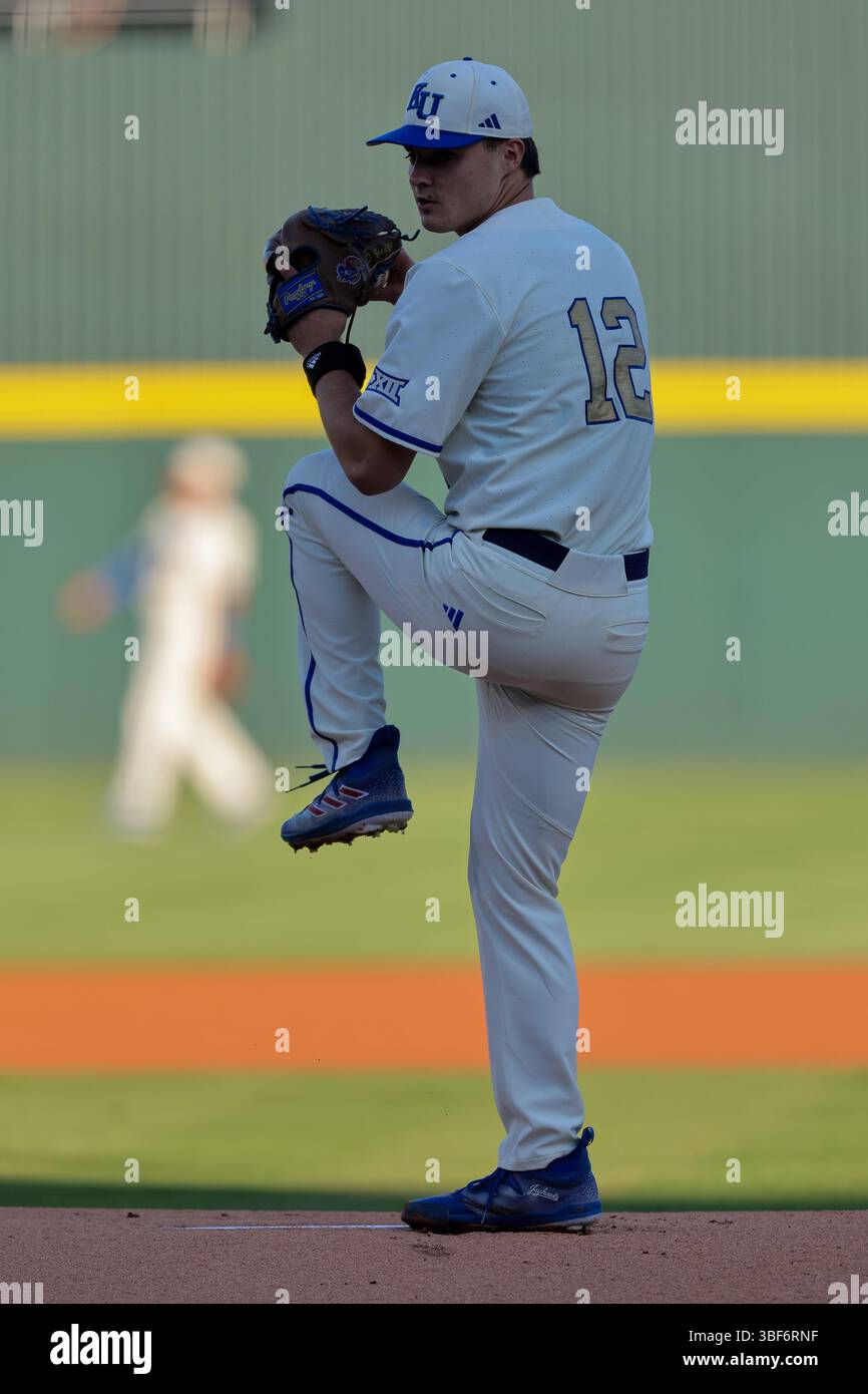 May 30, 2025: Jayhawks pitcher Dominic Voegele (12) begins his windup ...