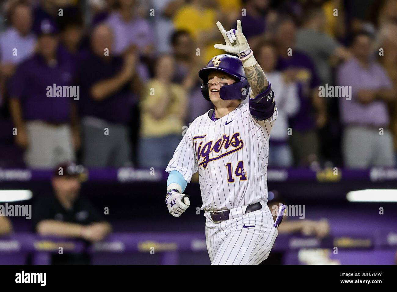 May 30, 2025: LSU's Daniel Dickinson (14) celebrates after hitting a ...