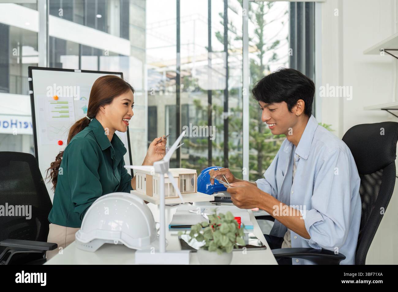 ESG and Sustainability. Engineers collaborating on eco-friendly ...