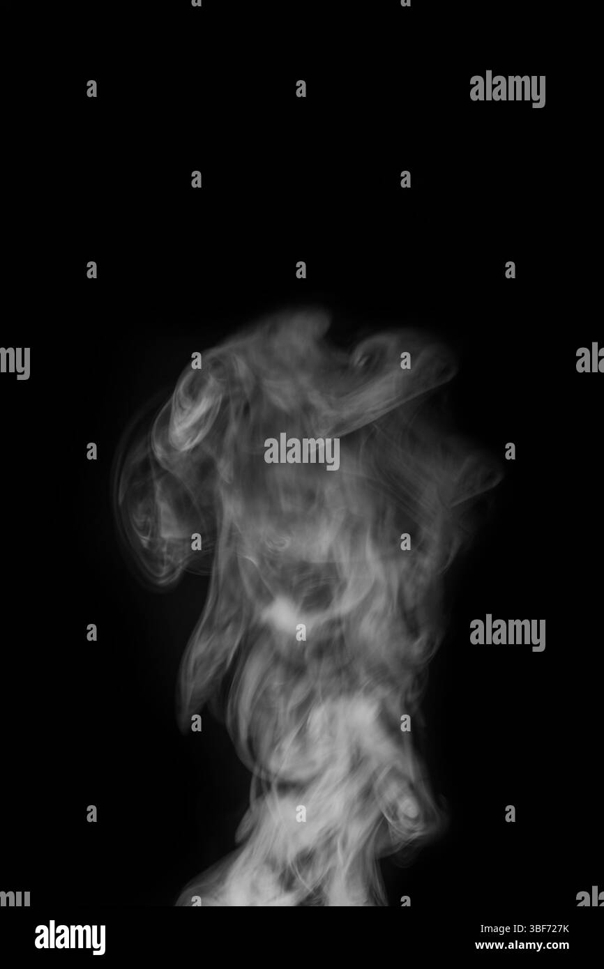 Ethereal wisps of smoke swirling gracefully against a dark background ...
