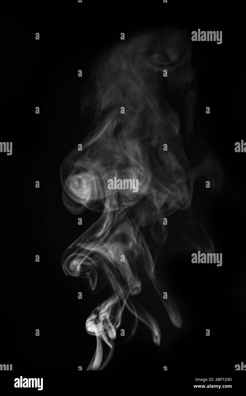 Ethereal smoke patterns swirling gracefully in the air creating a ...