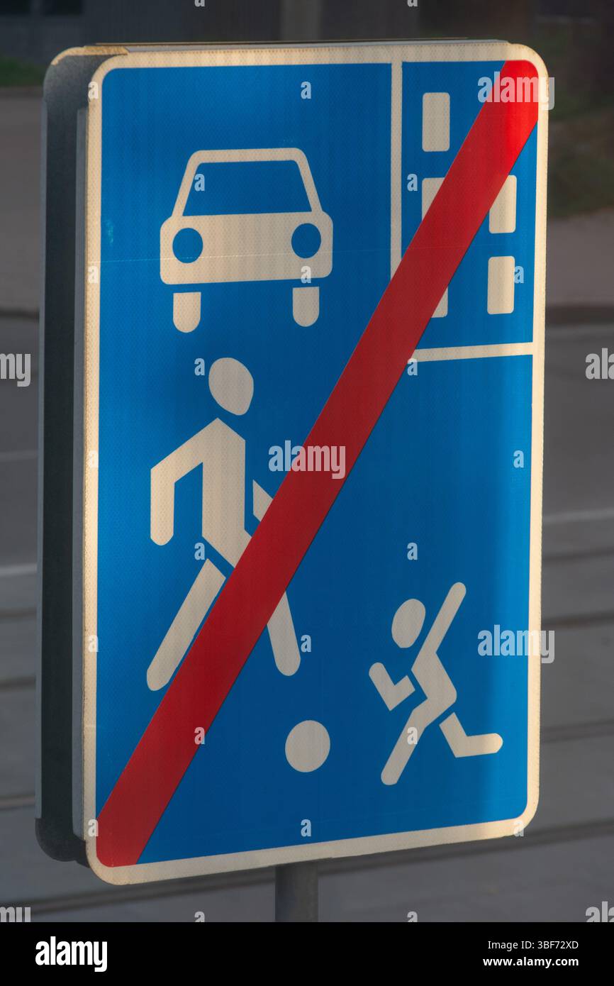 Traffic sign showing end of pedestrian zone with red diagonal line ...
