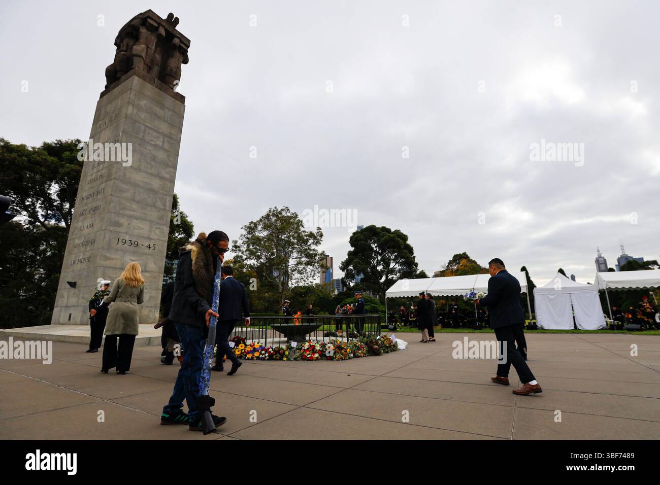 People lay wreaths during the Victorian Aboriginal Remembrance Service ...