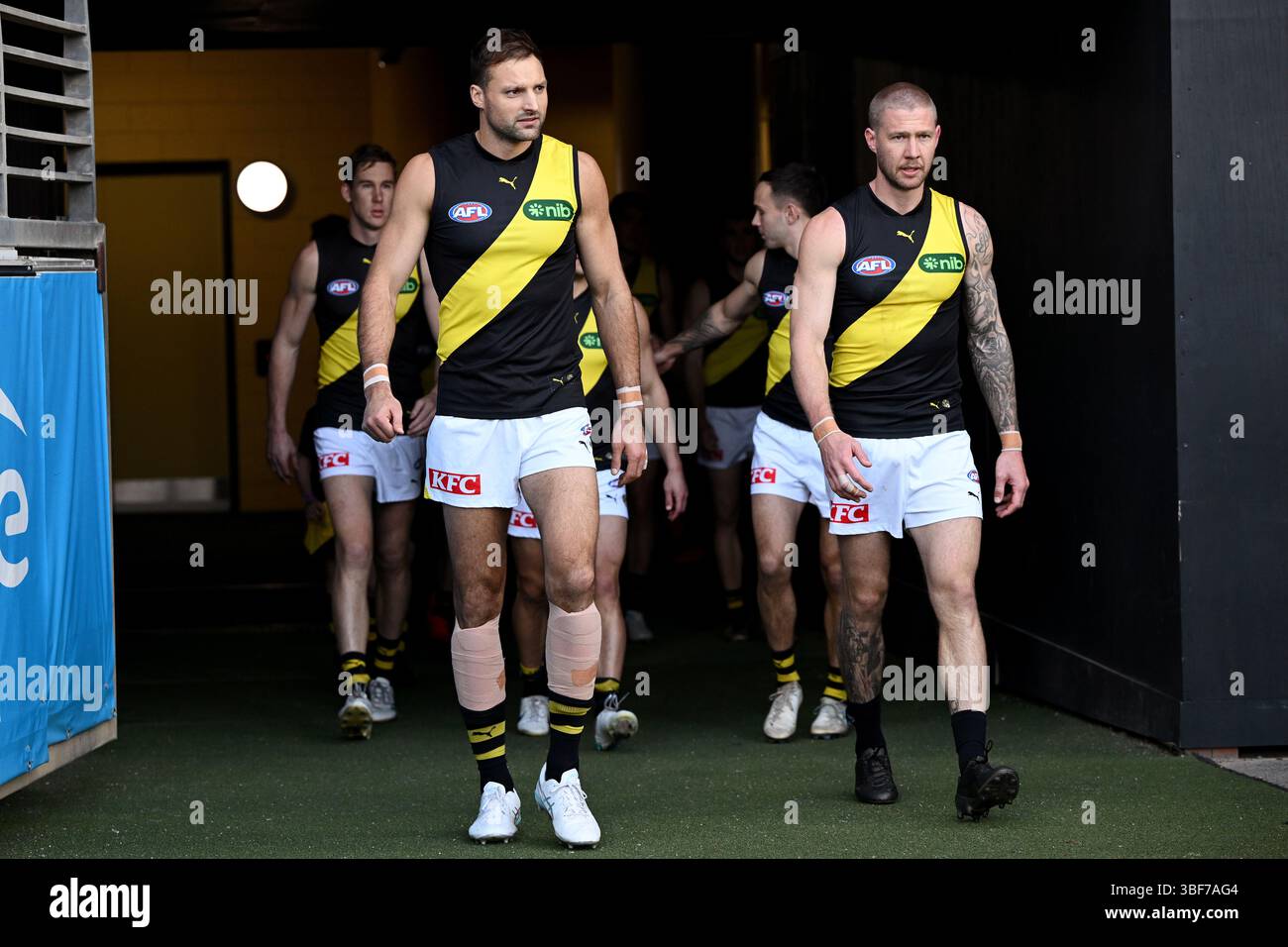 Toby Nankervis (left) and Nathan Broad of the Tigers lead their team ...