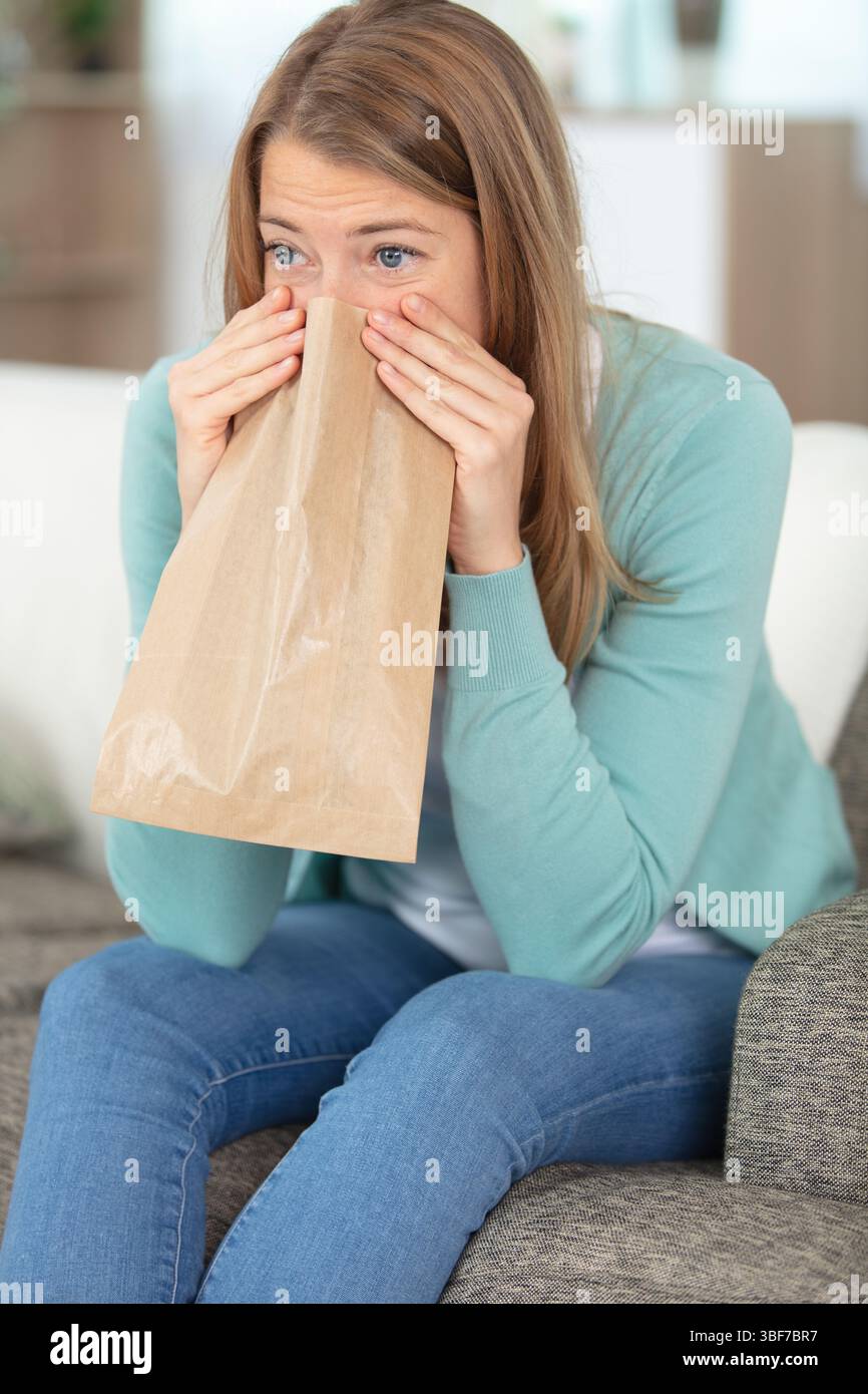 Breath into paper bag hi-res stock photography and images - Alamy