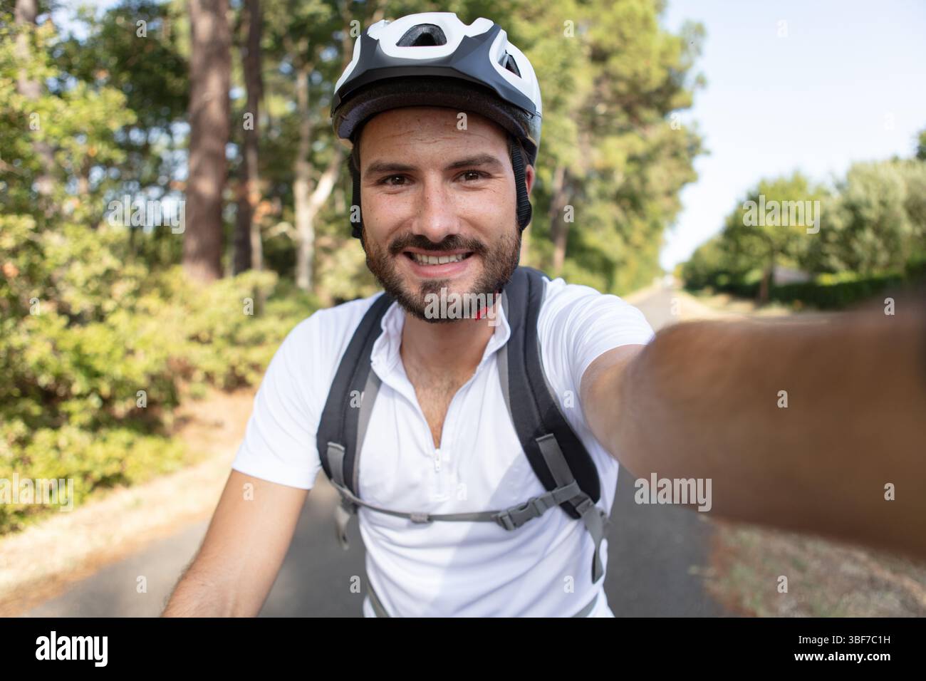 happy smiling cyclist man driving a bike taking selfie photo Stock ...
