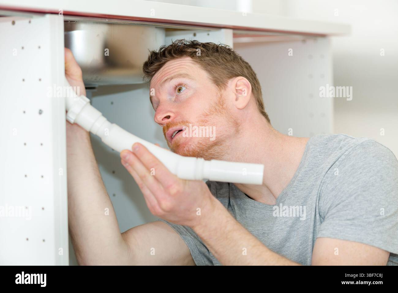Fixing leaking pipes hi-res stock photography and images - Alamy