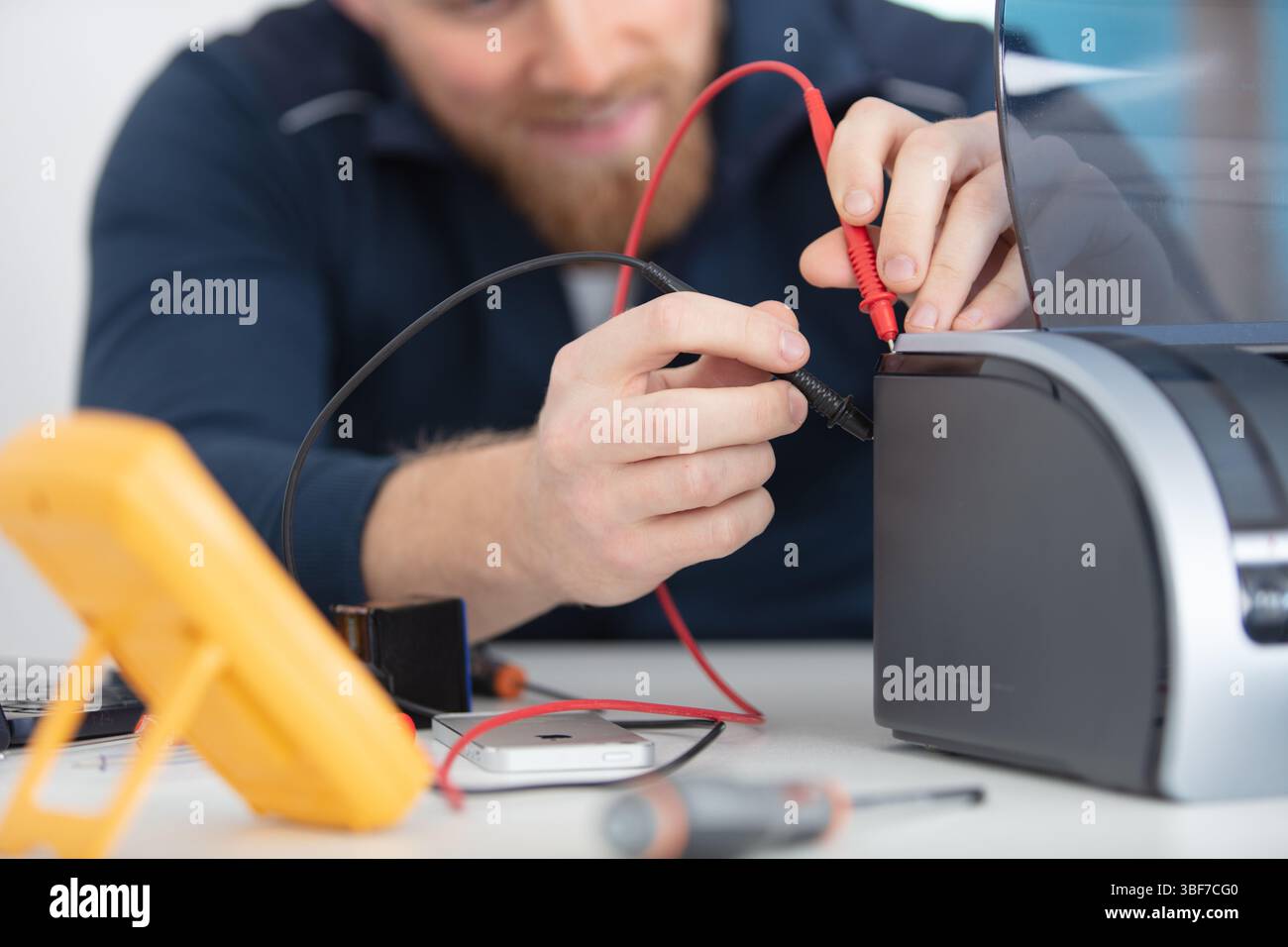 Technician testing printer multimeter hi-res stock photography and ...