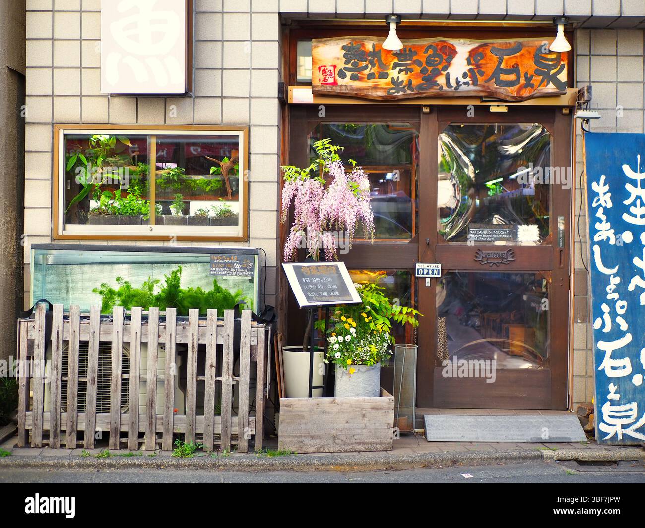 Tropical fish store facade with plants and signage in Tokyo Stock Photo ...