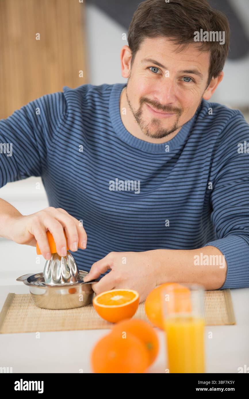 Woman pressing oranges hi-res stock photography and images - Alamy