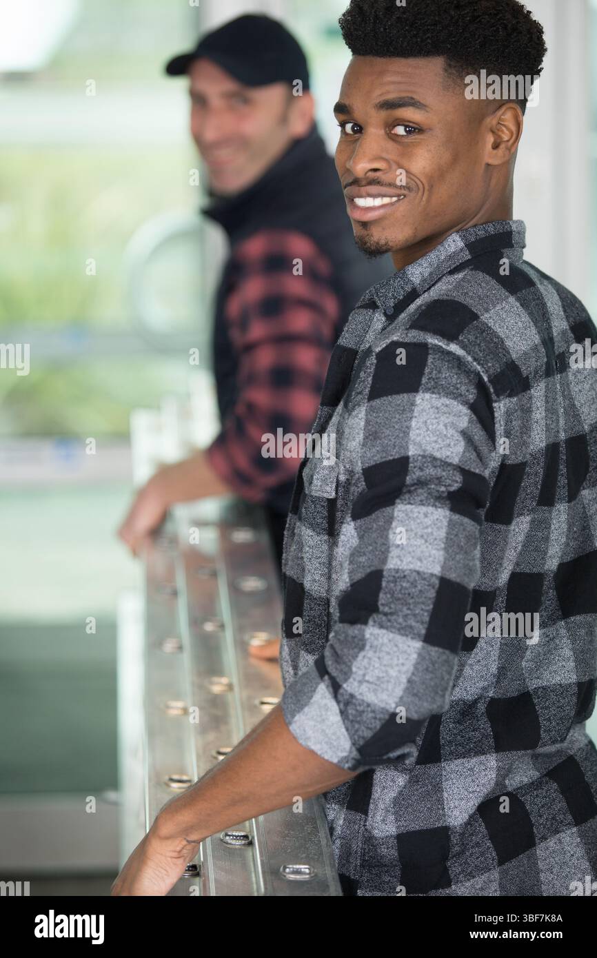 2 men ladder construction hi-res stock photography and images - Alamy