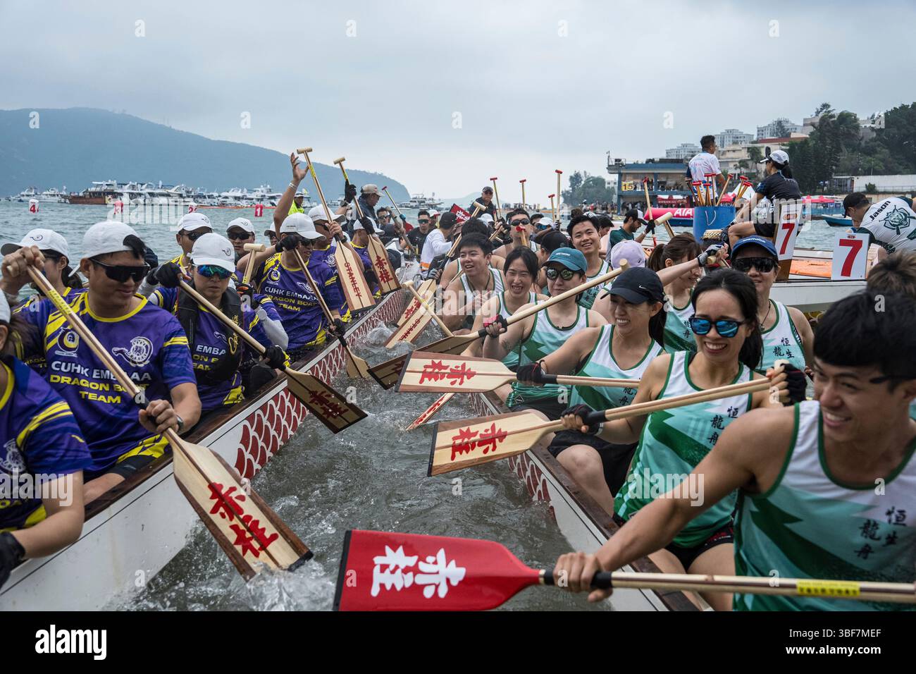 Competitors cheer and celebrate after the race in the Stanley International Dragon Boat ...