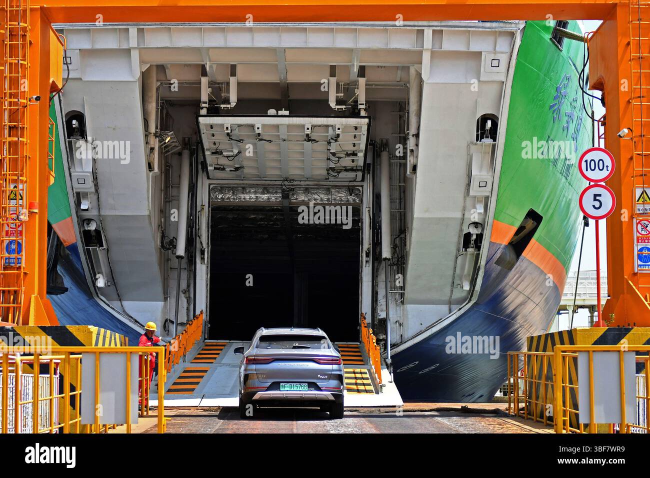 A car goes onto the ro-ro ship Lv An Tong during a trial in Yantai in ...