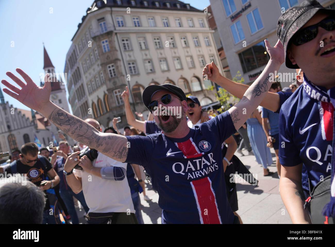 Paris Saint-Germain fans cheers at the Marienplatz in the city center ...