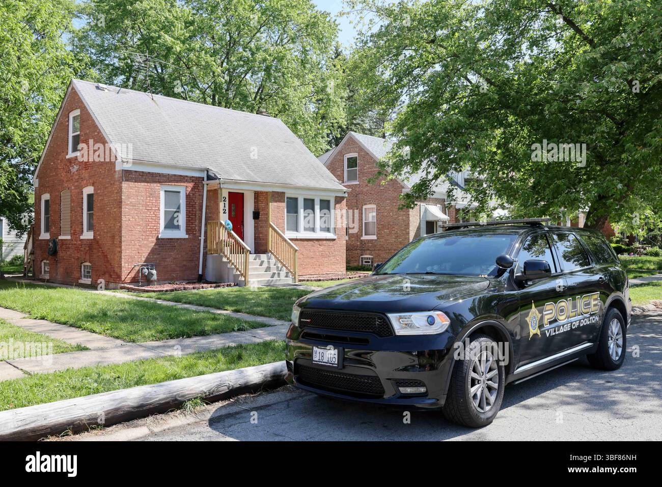 A police car is stationed at the childhood home of Pope Leo XIV is ...