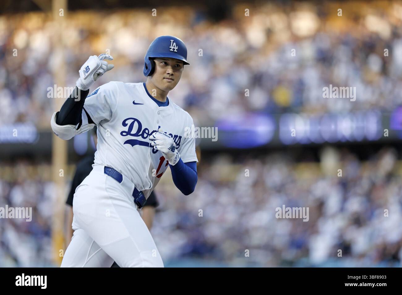 Los Angeles Dodgers designated hitter Shohei Ohtani rounds the bases ...