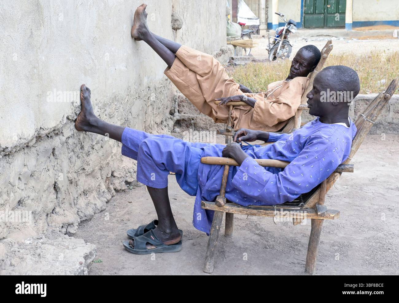 SOUTH-SUDAN, Lakes state, Rumbek, Dinka men resting on wooden chairs ...