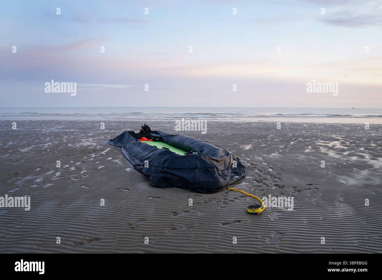 The remains of a small boat on the beach in Gravelines, France ...