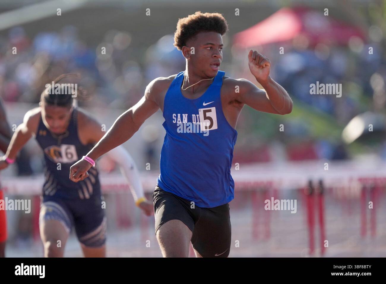 Jasir Fontenot of San Diego wins a 110m hurdles heat in a state meet ...