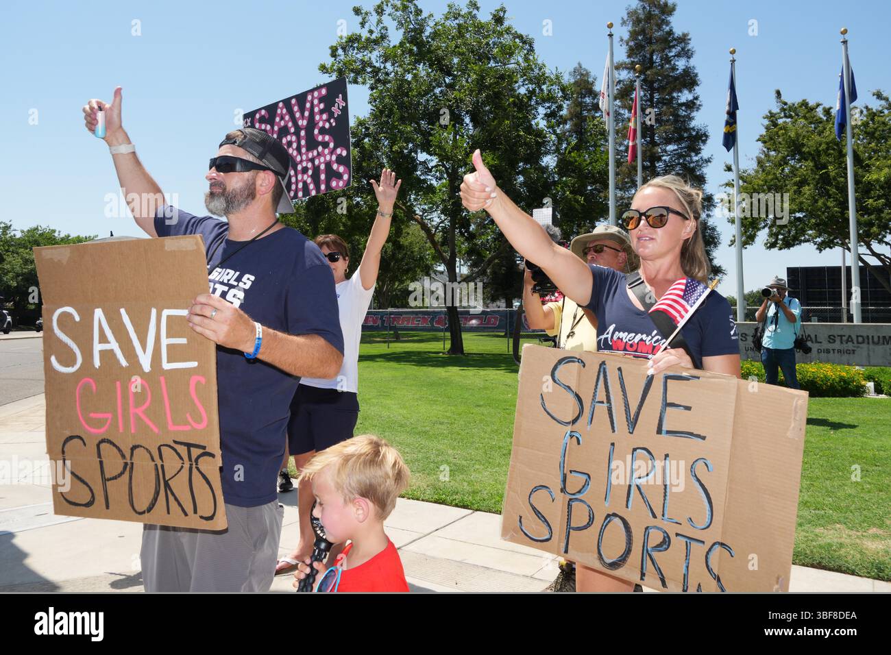 Fresno, United States. 30th May, 2025. People hold Save Girls Sports ...
