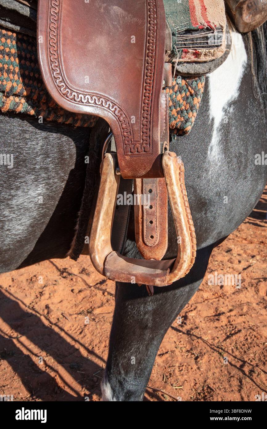 Stirrup of western saddle in the Monument Valley Navajo Tribal Park ...
