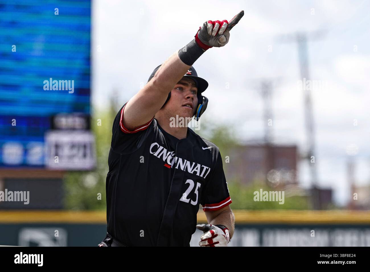 Cincinnati player Quinton Coats (25) gesturesw to teammates after ...
