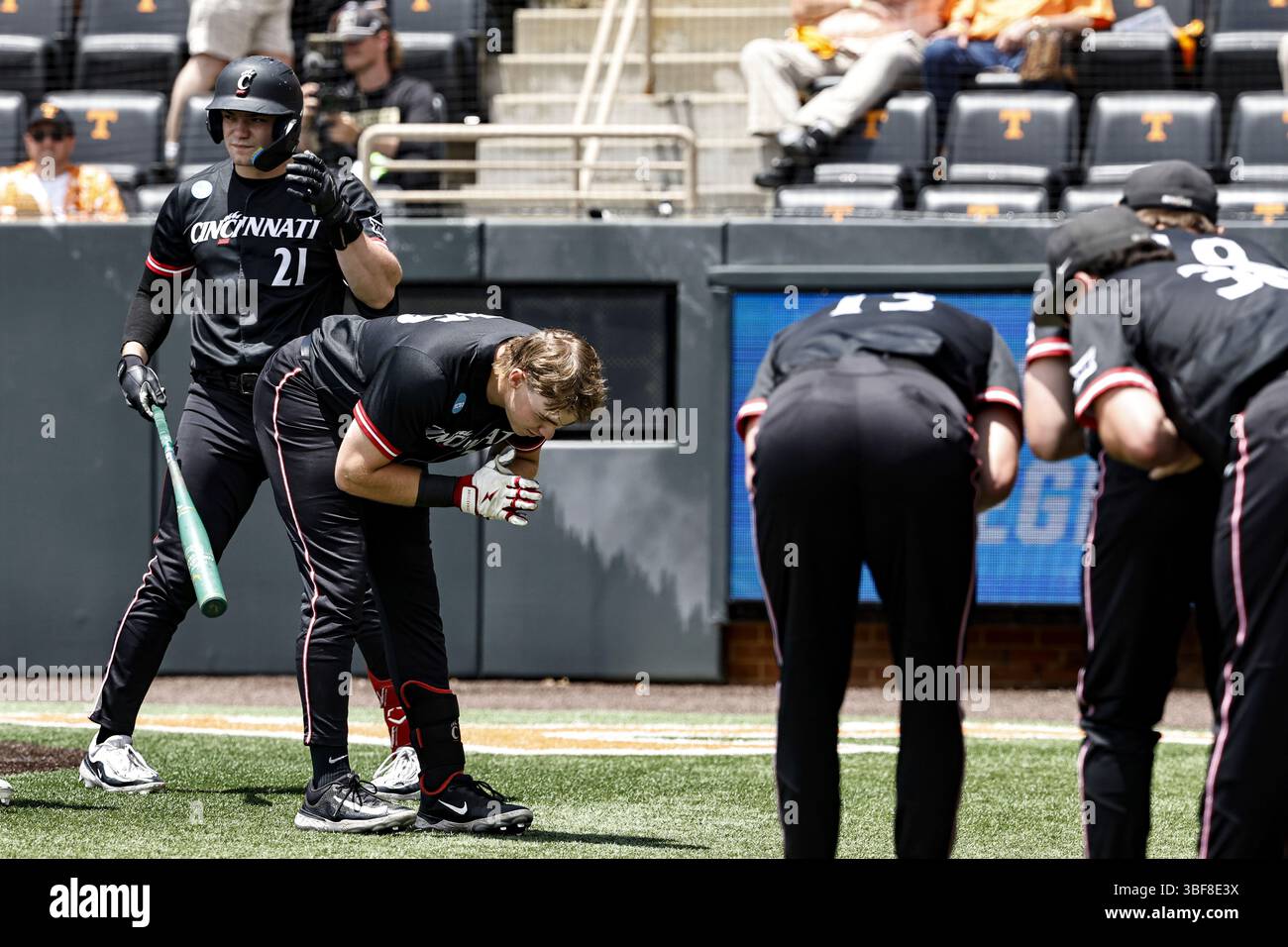 Cincinnati player Quinton Coats (25) bows to teammates after hitting a ...