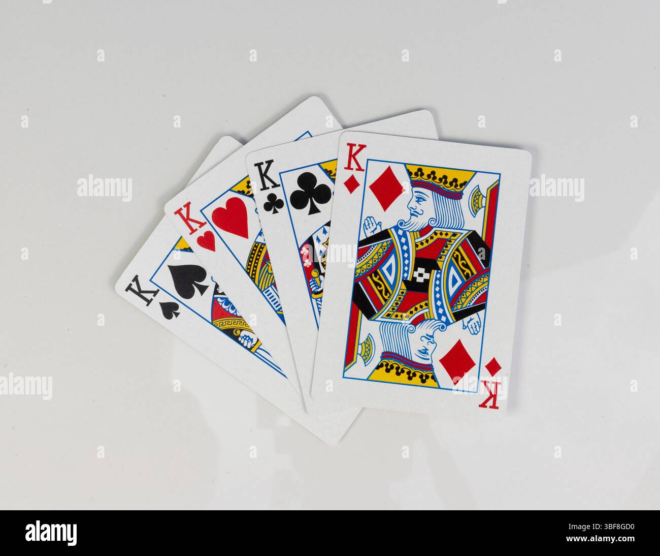 Four kings playing cards of diamonds, clubs, hearts and spades on white ...