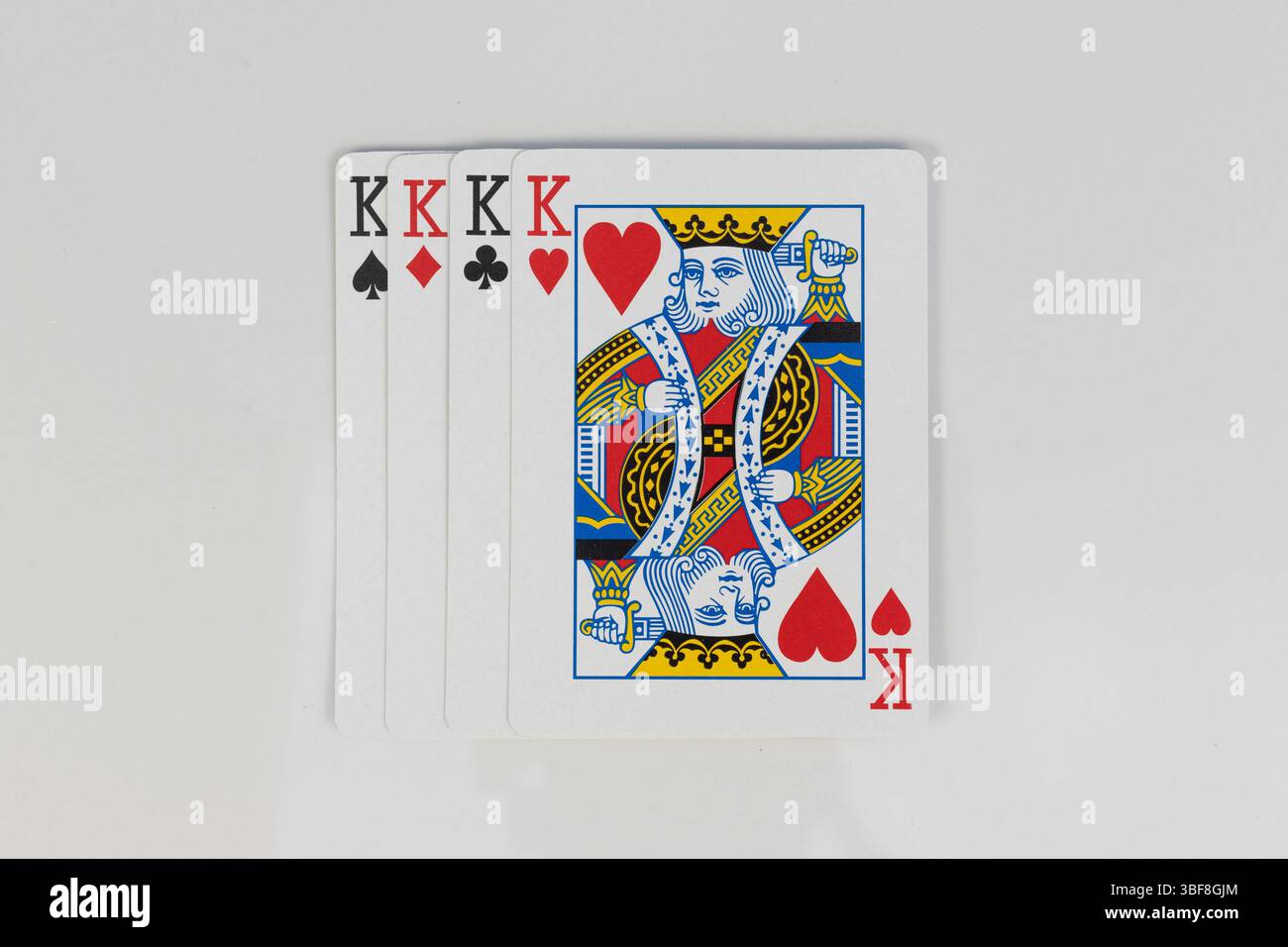 Four kings playing cards of diamonds, clubs, hearts and spades on white ...