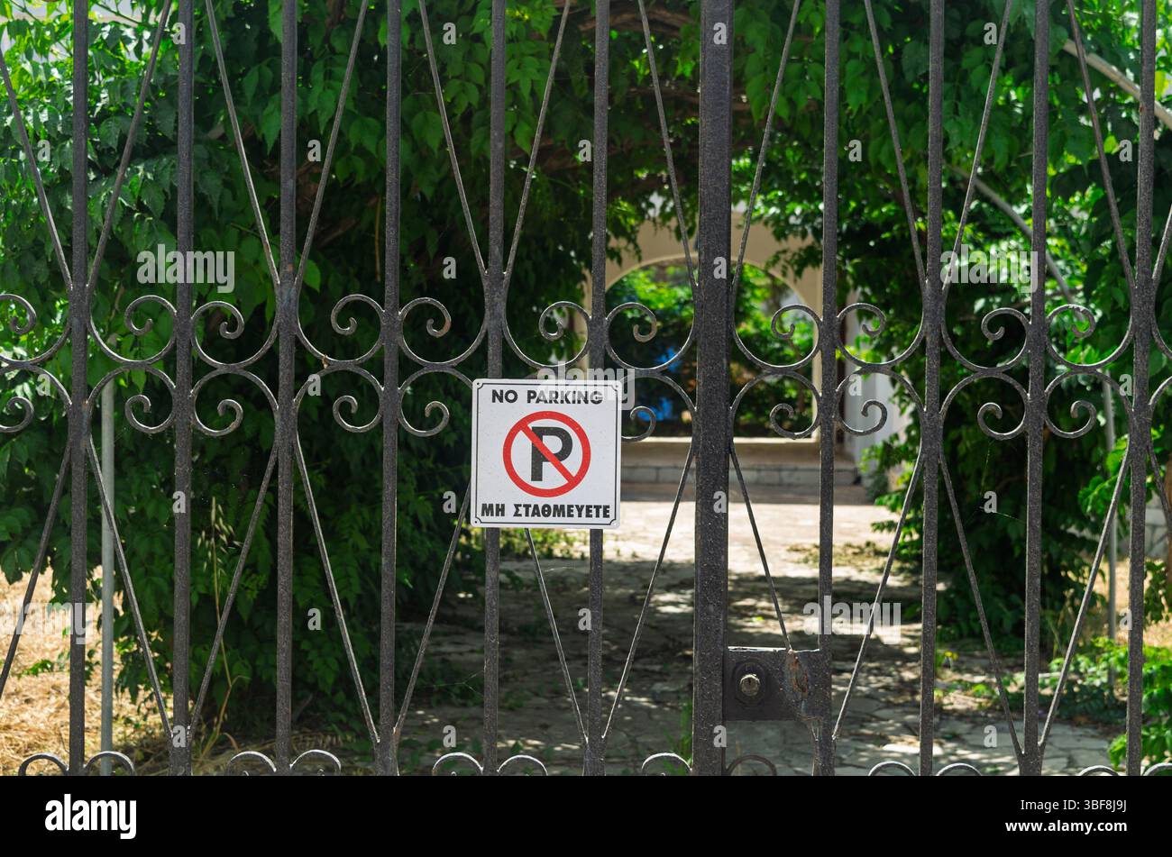 No parking sign on a gate in Zante chained to a locked gate Stock Photo ...