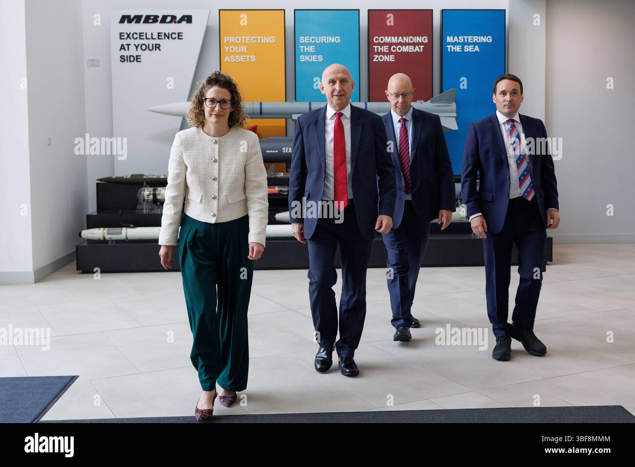 Britain's Defence Secretary John Healey, second left, visits the MBDA ...