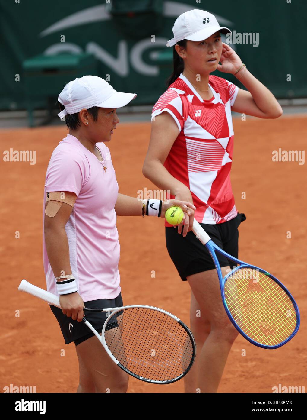 Paris, France. 31st May, 2025. Jiang Xinyu (L) and Wu Fang-Hsien react ...