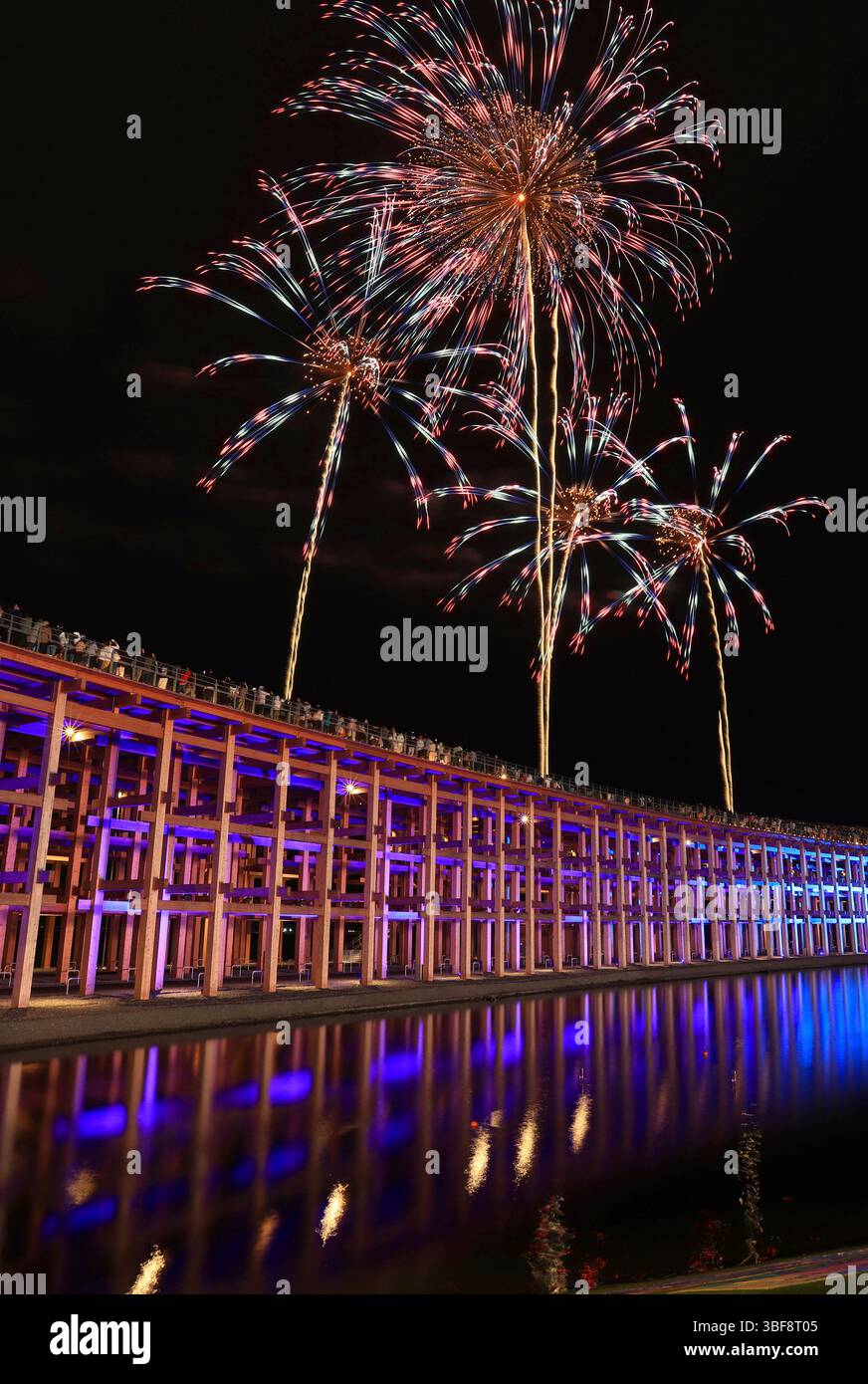 A 14-second exposure photograph captures fireworks coloring the night ...