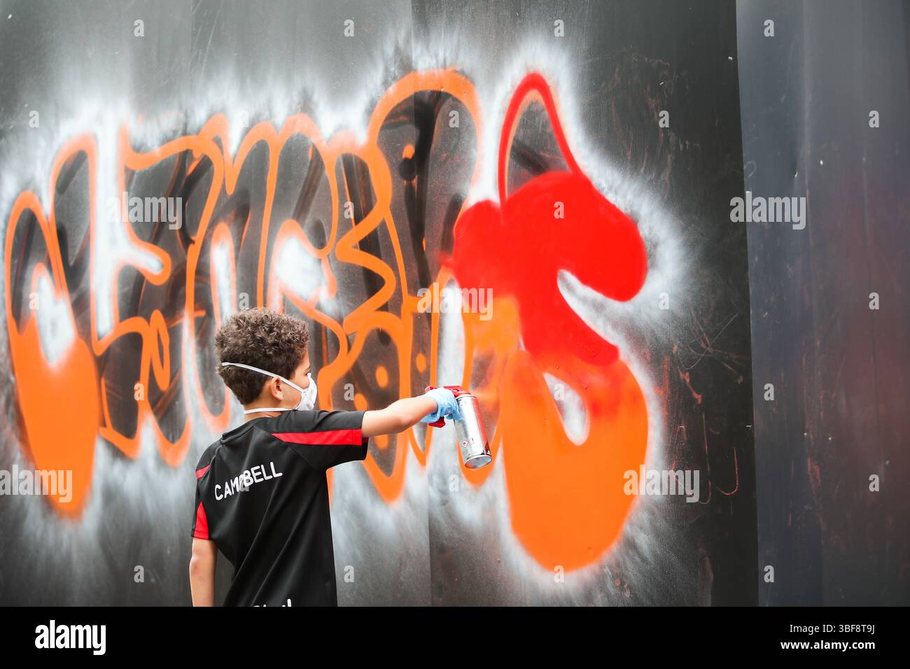 Birmingham, UK. 31st May, 2025. A young boy shows off his graffiti ...