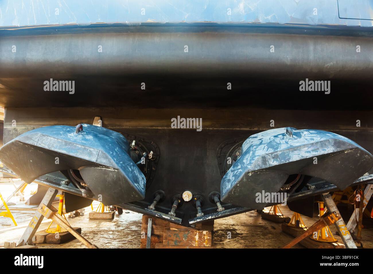 The back of the yacht with water-jet motors on it. Yacht in a dry dock ...