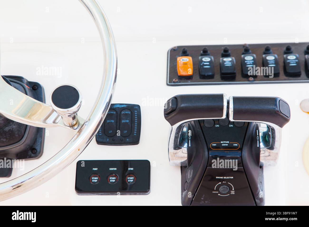 Motor yacht control panel. Steering wheel and gear levers Stock Photo ...