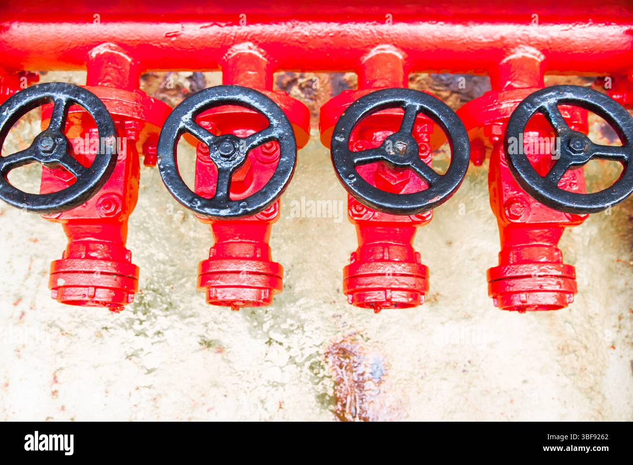 Four red fire hydrants on a fire line on a ship Stock Photo - Alamy