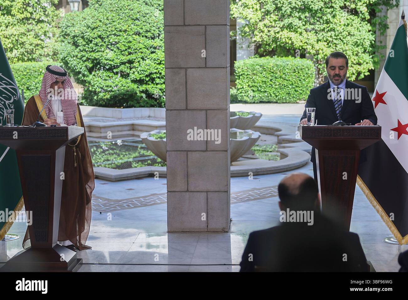 Syrian Foreign Minister Asaad al-Shibani, right, speaks during a joint ...