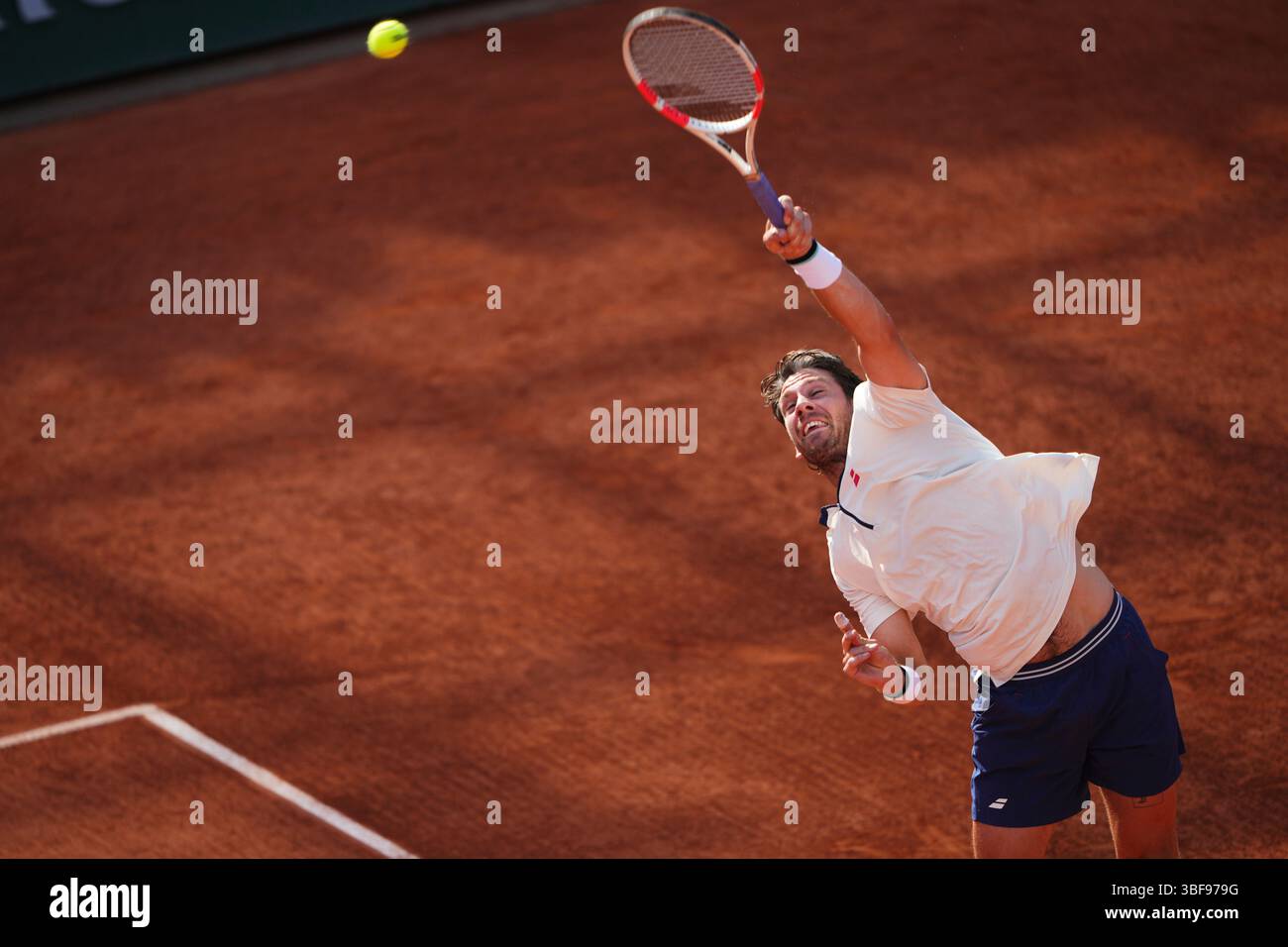 Britain's Cameron Norrie serves against Britain's Jacob Fearnley during ...