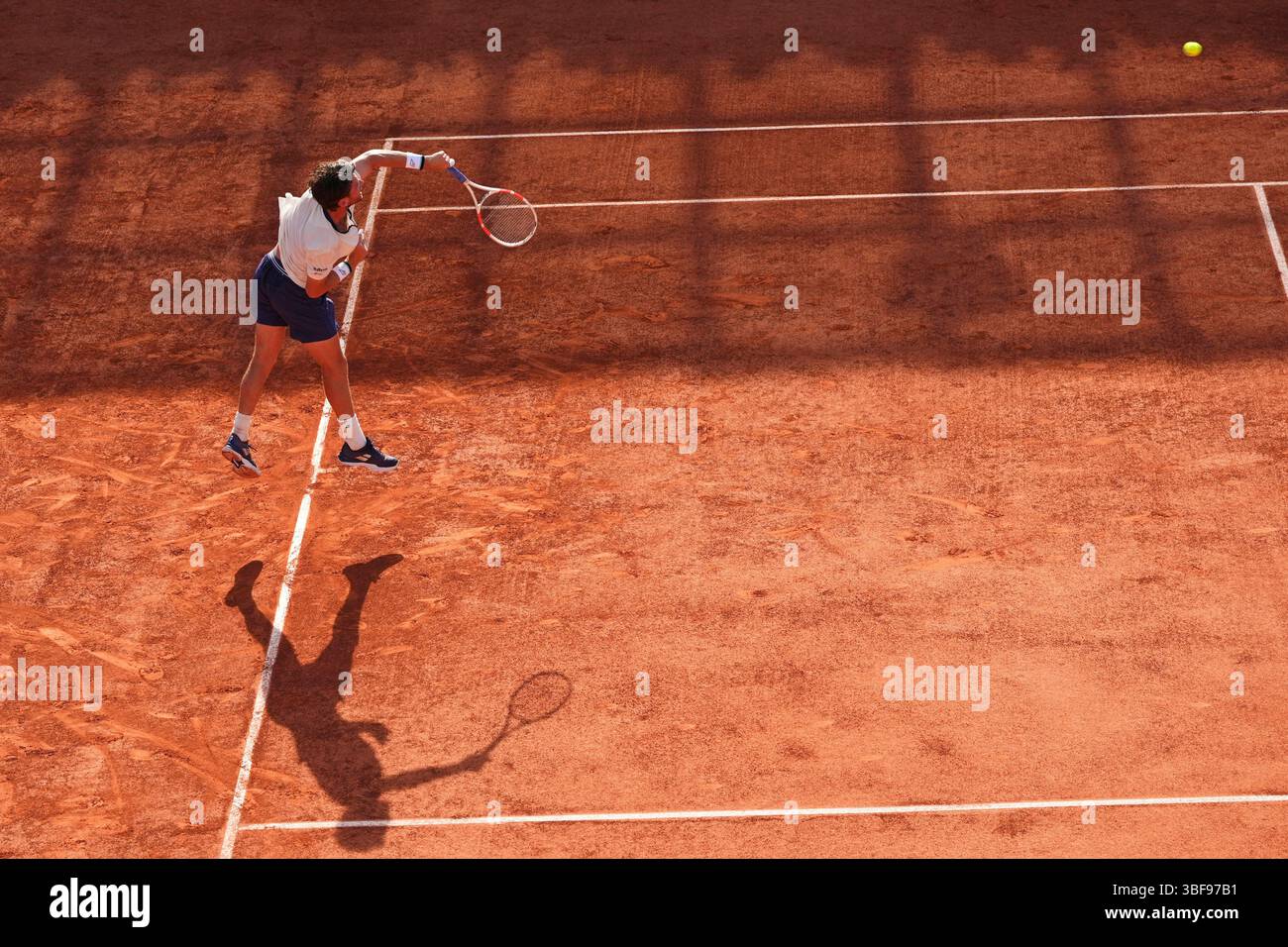Britain's Cameron Norrie serves against Britain's Jacob Fearnley during ...