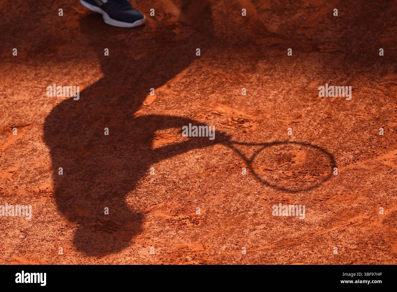 Britain's Cameron Norrie casts his shadow on the court as he plays ...