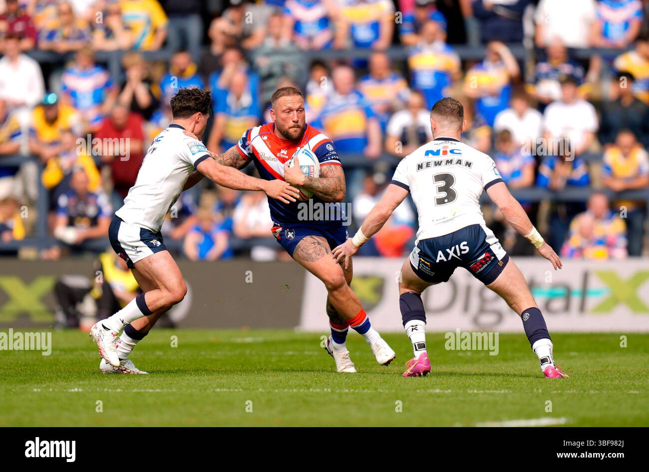 Wakefield Trinity's Josh Griffin (centre) tackled by Leeds Rhinos ...