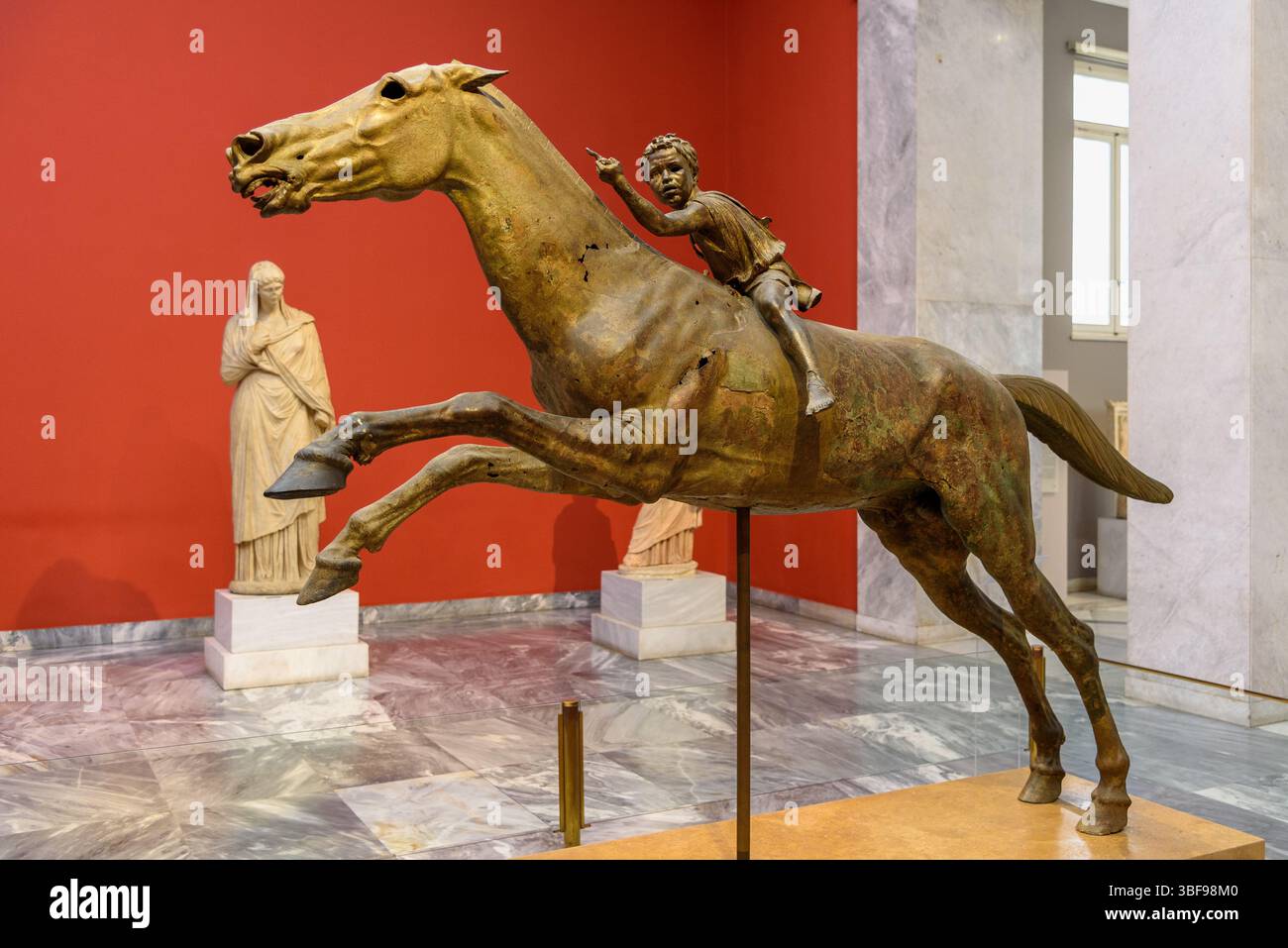 Bronze statue of a horse and young jockey. Retrieved in pieces from the ...