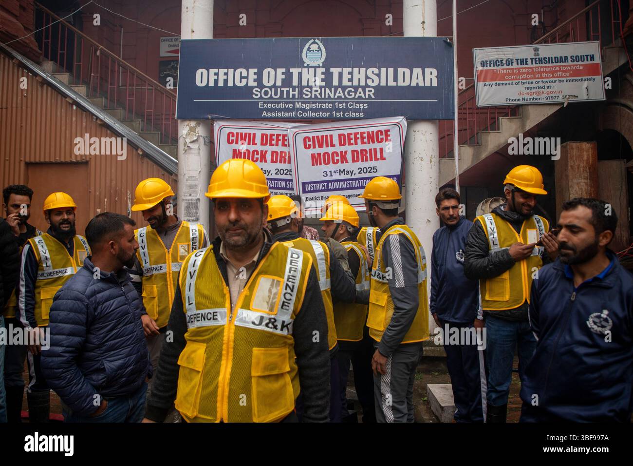 Civil Defence workers participate in a civil defence mock drill inside ...