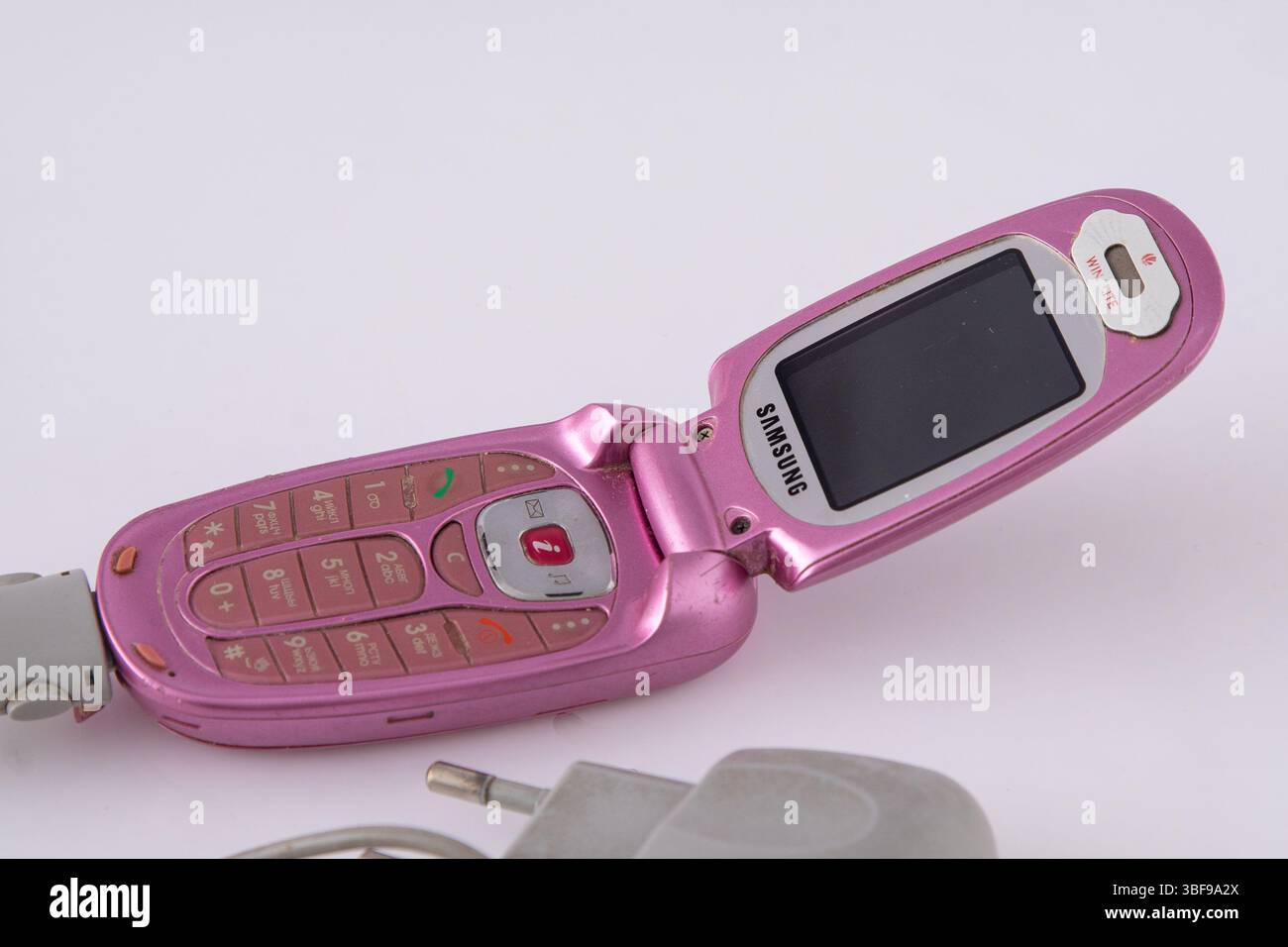 Old Samsung push button flip phone. Pink color with charger. Retro ...