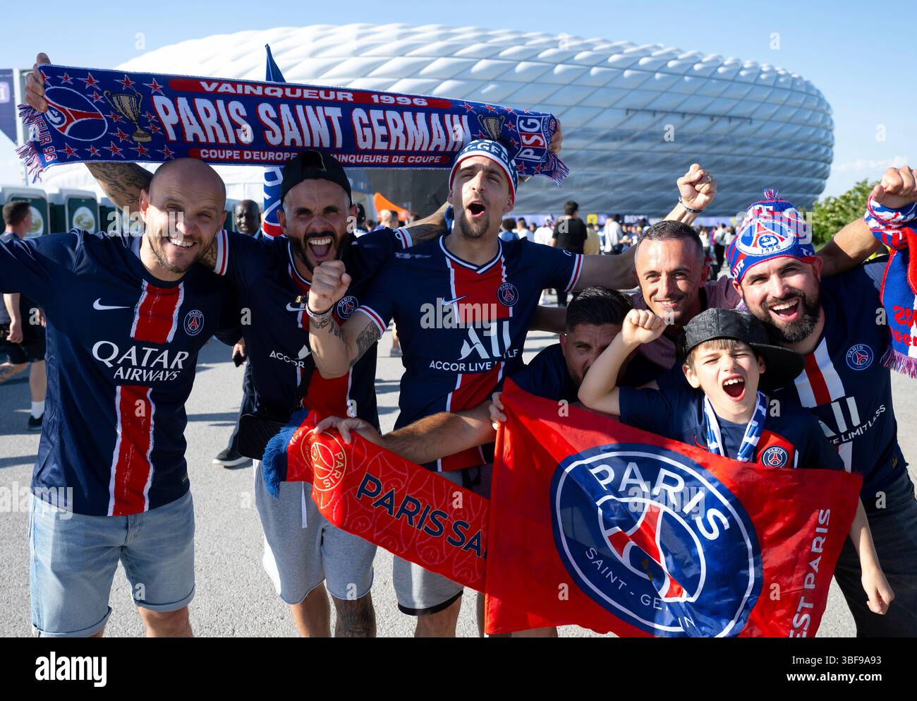PSG supporters react as they arrive ahead of the Champions League final ...