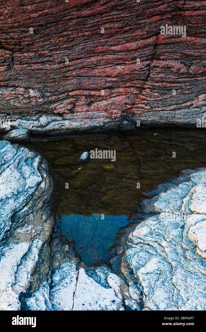 Coastal cliff formations in Sweden showcase unique rock layers with a ...