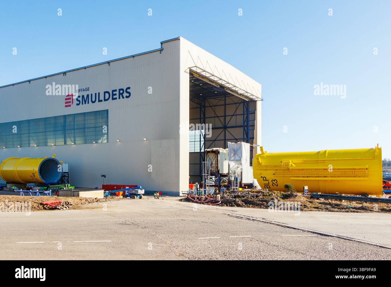 smulders Industrial fabrication facility exterior showing large yellow ...