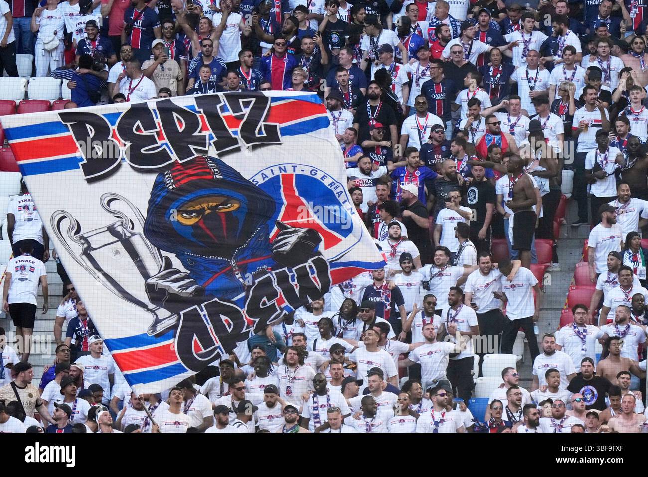 PSG fans wave flags on the stands ahead of the Champions League final ...